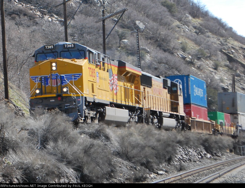 UP 7385 gets closer to me as she rolls west into Ogden, Ut.